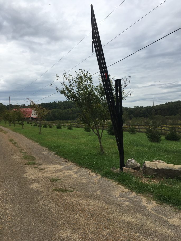 KEG Gates™Vertical lift entry gatesOpen 12 foot KEG gate on farm driveway